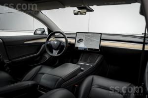 White Tesla Model 3 2021 in Riga, with an engine capacity of 0.00 L and mileage of 82 thousand km for 23990 €, photo 20 on AUTOMOTO.COM.LV
