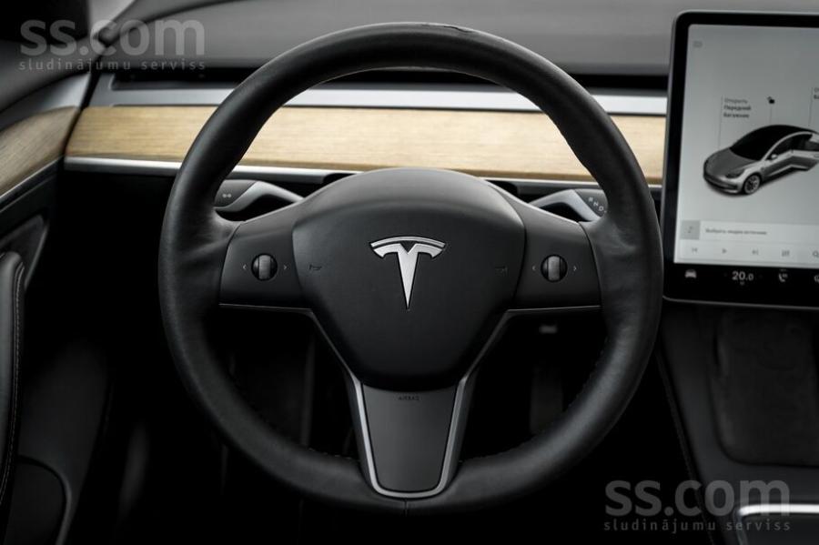 White Tesla Model 3 2021 in Riga, with an engine capacity of 0.00 L and mileage of 82 thousand km for 23990 €, photo 23 on AUTOMOTO.COM.LV