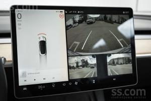White Tesla Model 3 2021 in Riga, with an engine capacity of 0.00 L and mileage of 82 thousand km for 23990 €, photo 26 on AUTOMOTO.COM.LV