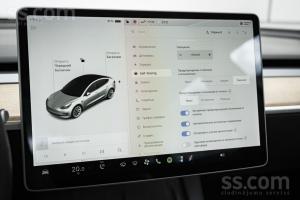 White Tesla Model 3 2021 in Riga, with an engine capacity of 0.00 L and mileage of 82 thousand km for 23990 €, photo 28 on AUTOMOTO.COM.LV