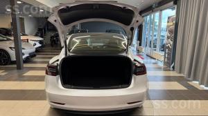 White Tesla Model 3 2021 in Riga, with an engine capacity of 0.00 L and mileage of 111 thousand km for 21990 €, photo 20 on AUTOMOTO.COM.LV