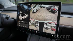 White Tesla Model 3 2021 in Riga, with an engine capacity of 0.00 L and mileage of 126 thousand km for 27450 €, photo 25 on AUTOMOTO.COM.LV