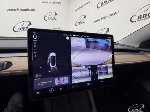 White Tesla Model 3 2021 in Vilnius, with an engine capacity of 0.00 L and mileage of 106 thousand km for 23500 €, photo 31 on AUTOMOTO.COM.LV