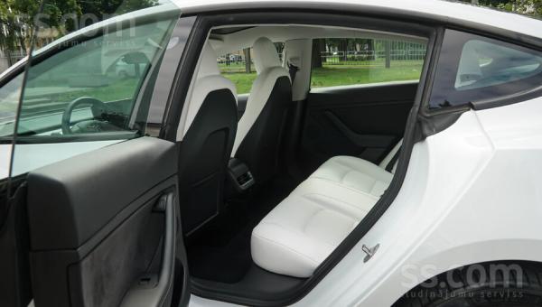 White Tesla Model 3 2021 in Riga, with an engine capacity of 0.00 L and mileage of 81 thousand km for 24950 €, photo 11 on AUTOMOTO.COM.LV