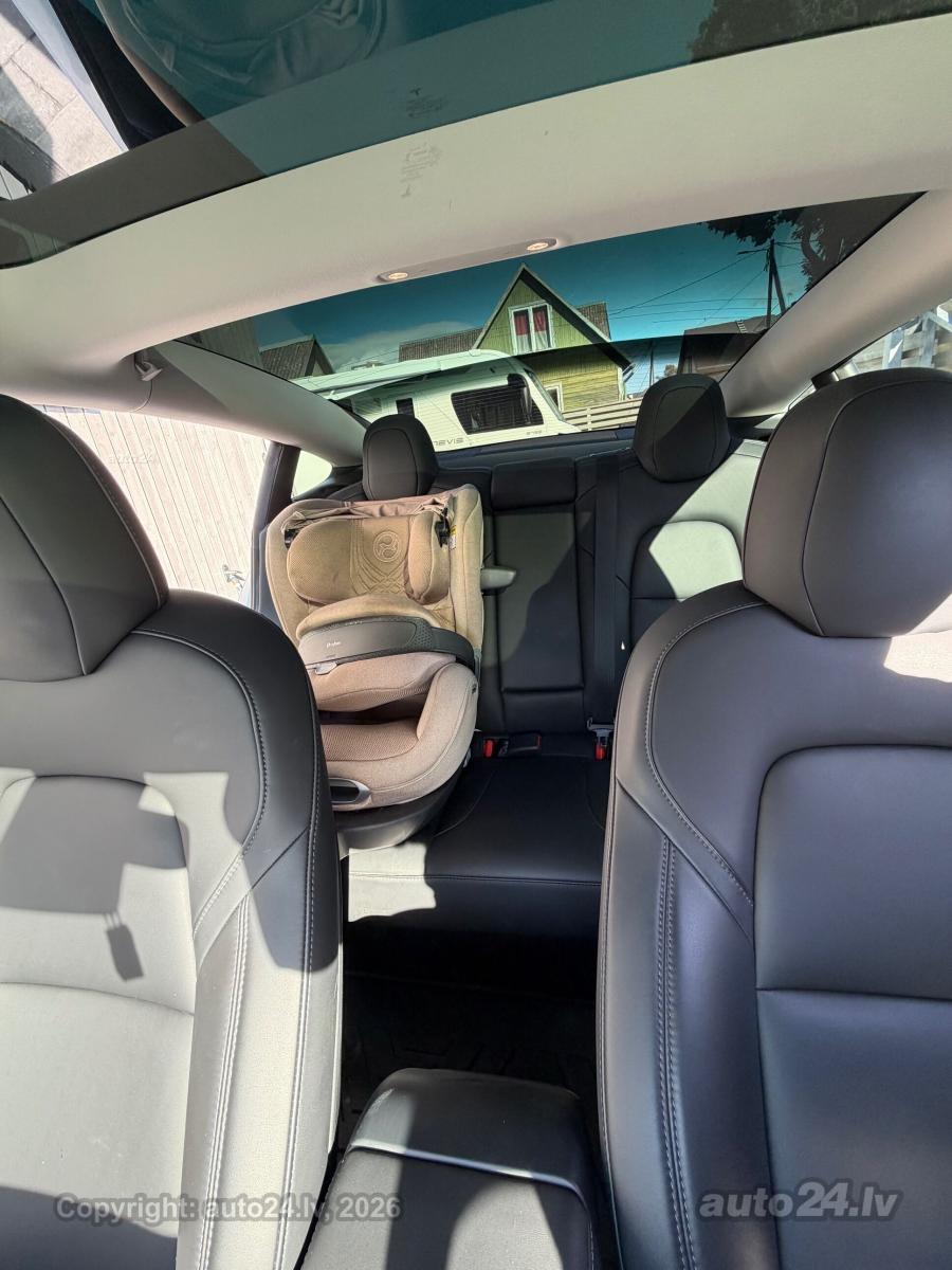 White Tesla Model 3 2021 in Tallinn, with an engine capacity of 0.00 L and mileage of 72 thousand km for 28900 €, photo 9 on AUTOMOTO.COM.LV