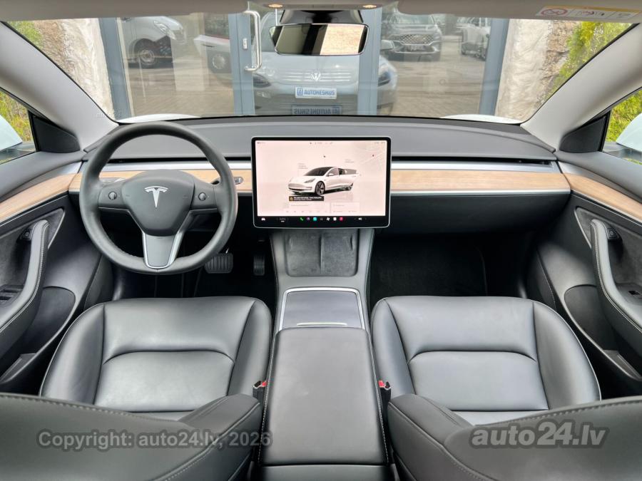 White Tesla Model 3 2022 in Tallinn, with an engine capacity of 0.00 L and mileage of 61 thousand km for 32990 €, photo 6 on AUTOMOTO.COM.LV