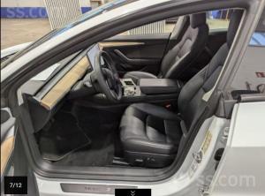 White Tesla Model 3 2022 in Riga, with an engine capacity of 0.00 L and mileage of 137 thousand km for 26650 €, photo 6 on AUTOMOTO.COM.LV