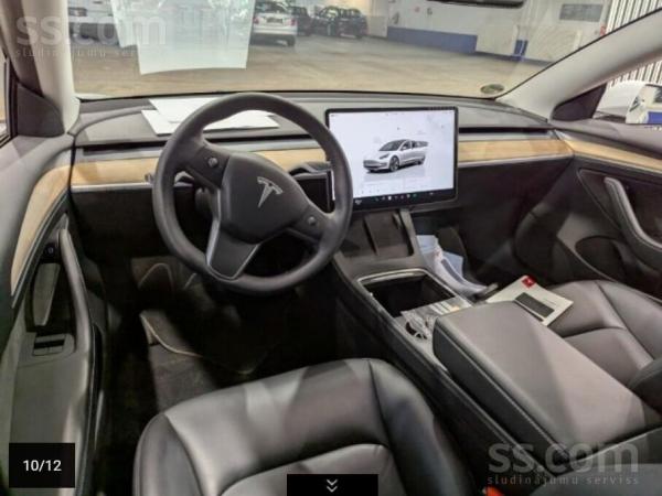 White Tesla Model 3 2022 in Riga, with an engine capacity of 0.00 L and mileage of 137 thousand km for 26650 €, photo 6 on AUTOMOTO.COM.LV