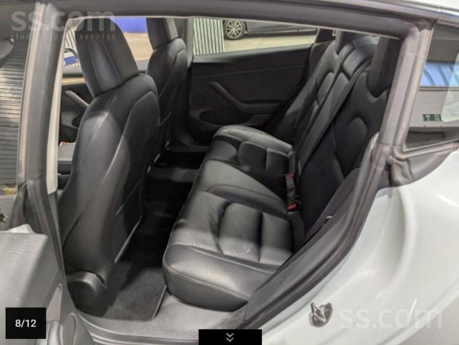 White Tesla Model 3 2022 in Riga, with an engine capacity of 0.00 L and mileage of 137 thousand km for 26650 €, photo 9 on AUTOMOTO.COM.LV
