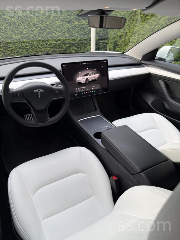 White Tesla Model 3 2023 in Riga, with an engine capacity of 0.00 L and mileage of 65 thousand km for 31000 €, photo 6 on AUTOMOTO.COM.LV