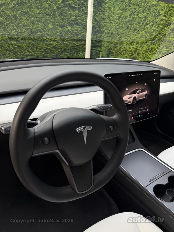 White Tesla Model 3 2023 in Tallinn, with an engine capacity of 0.00 L and mileage of 65 thousand km for 32500 €, photo 10 on AUTOMOTO.COM.LV