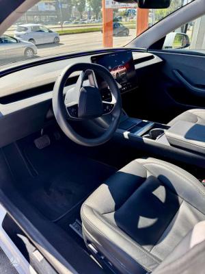 White Tesla Model 3 2024 in Klaipeda, with an engine capacity of 0.00 L and mileage of 37 thousand km for 29900 €, photo 12 on AUTOMOTO.COM.LV