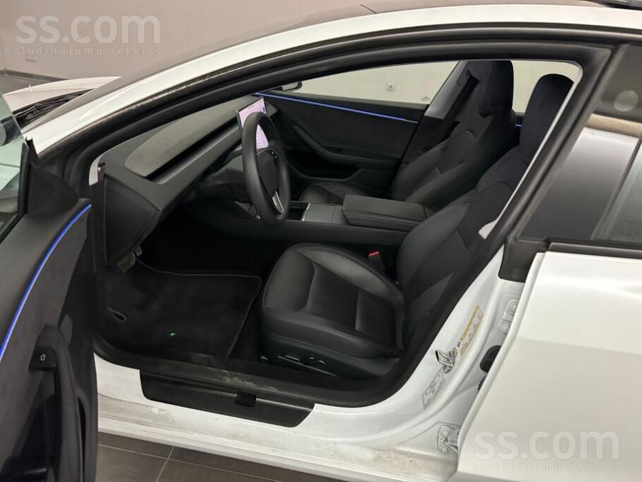 White Tesla Model 3 2024 in Riga, with an engine capacity of 0.00 L and mileage of 75 thousand km for 42000 €, photo 6 on AUTOMOTO.COM.LV