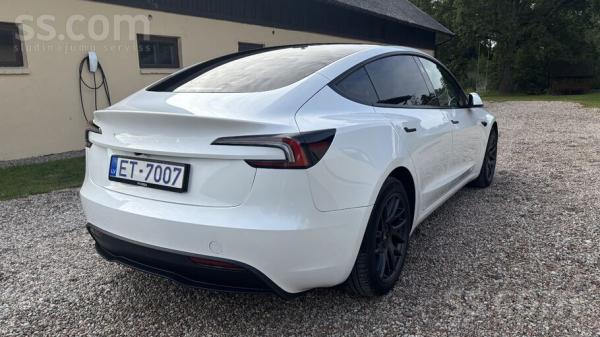 White Tesla Model 3 2024 in Riga, with an engine capacity of 0.00 L and mileage of 70 thousand km for 35200 €, photo 3 on AUTOMOTO.COM.LV
