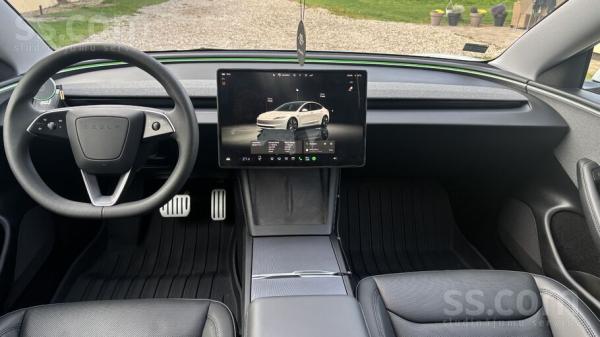 White Tesla Model 3 2024 in Riga, with an engine capacity of 0.00 L and mileage of 70 thousand km for 35200 €, photo 7 on AUTOMOTO.COM.LV