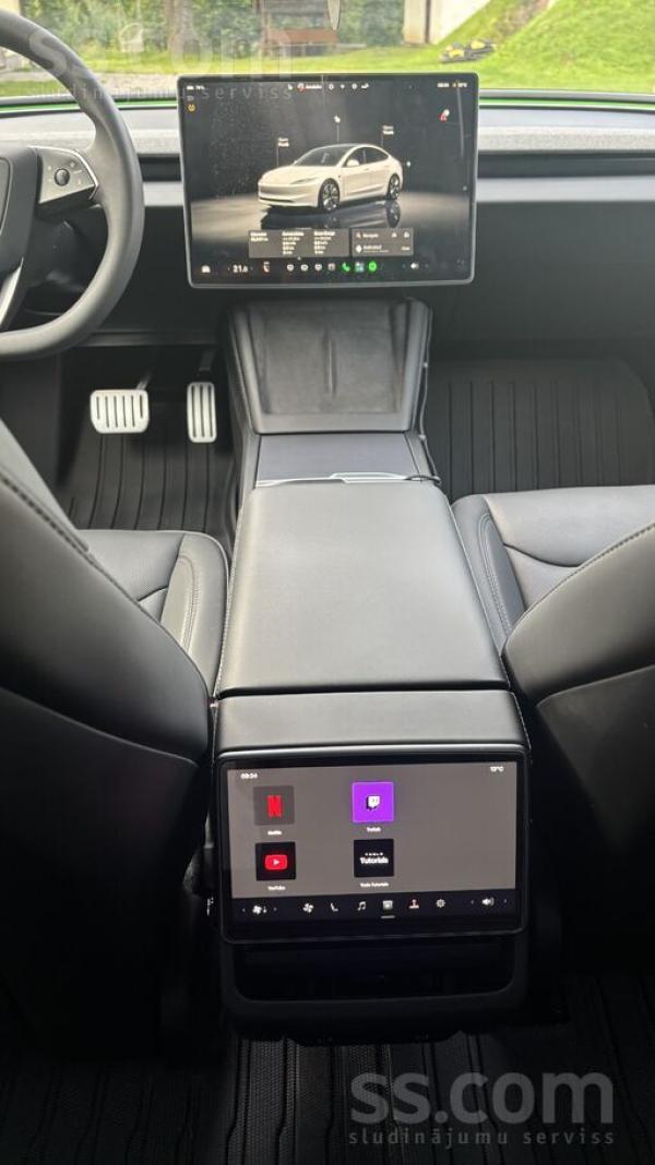 White Tesla Model 3 2024 in Riga, with an engine capacity of 0.00 L and mileage of 70 thousand km for 35200 €, photo 8 on AUTOMOTO.COM.LV