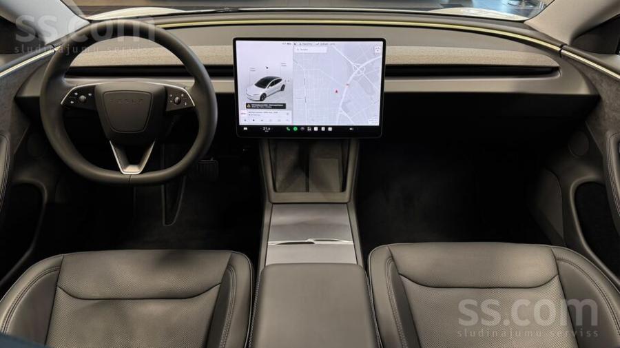 White Tesla Model 3 2024 in Riga, with an engine capacity of 0.00 L and mileage of 75 thousand km for 42000 €, photo 11 on AUTOMOTO.COM.LV