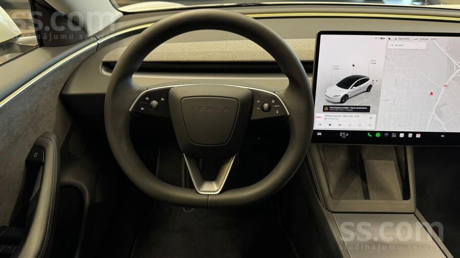 White Tesla Model 3 2024 in Riga, with an engine capacity of 0.00 L and mileage of 75 thousand km for 42000 €, photo 12 on AUTOMOTO.COM.LV