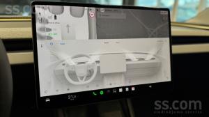 White Tesla Model 3 2024 in Riga, with an engine capacity of 0.00 L and mileage of 75 thousand km for 40990 €, photo 17 on AUTOMOTO.COM.LV