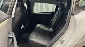 White Tesla Model 3 2024 in Riga, with an engine capacity of 0.00 L and mileage of 75 thousand km for 40990 €, photo 24 on AUTOMOTO.COM.LV