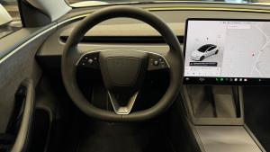 White Tesla Model 3 2024 in Riga, with an engine capacity of 0.00 L and mileage of 75 thousand km for 42000 €, photo 11 on AUTOMOTO.COM.LV