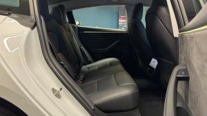 White Tesla Model 3 2024 in Riga, with an engine capacity of 0.00 L and mileage of 75 thousand km for 42000 €, photo 20 on AUTOMOTO.COM.LV