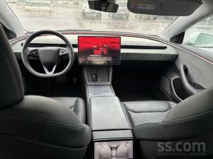 White Tesla Model 3 2024 in Riga, with an engine capacity of 0.00 L and mileage of 50 thousand km for 23000 €, photo 5 on AUTOMOTO.COM.LV