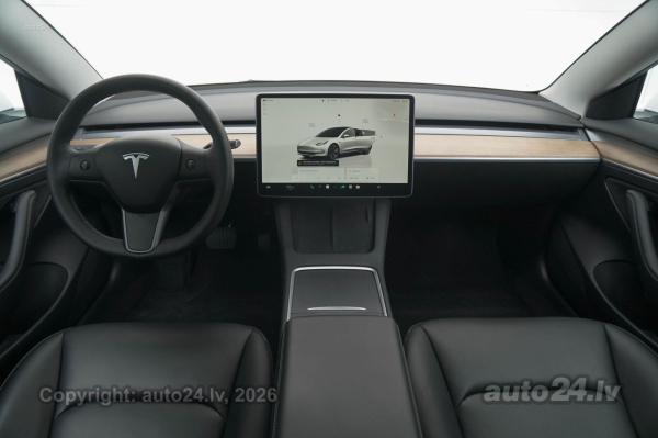 White Tesla Model 3 2022 in Tallinn, with an engine capacity of 0.00 L and mileage of 70 thousand km for 33990 €, photo 7 on AUTOMOTO.COM.LV