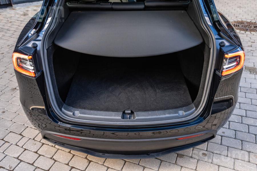 Black Tesla Model Y 2022 in Riga, with an engine capacity of 0.00 L and mileage of 41 thousand km for 38990 €, photo 36 on AUTOMOTO.COM.LV