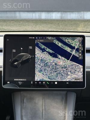 Black Tesla Model Y 2021 in Riga, with an engine capacity of 0.00 L and mileage of 88 thousand km for 30400 €, photo 9 on AUTOMOTO.COM.LV