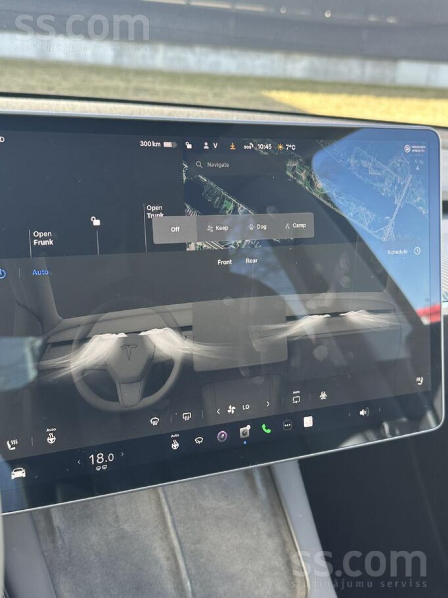 Black Tesla Model Y 2021 in Riga, with an engine capacity of 0.00 L and mileage of 88 thousand km for 30400 €, photo 12 on AUTOMOTO.COM.LV