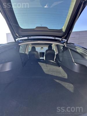 Black Tesla Model Y 2021 in Riga, with an engine capacity of 0.00 L and mileage of 88 thousand km for 30400 €, photo 19 on AUTOMOTO.COM.LV