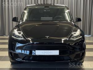 Black Tesla Model Y 2021 in Riga, with an engine capacity of 0.00 L and mileage of 106 thousand km for 32990 €, photo 3 on AUTOMOTO.COM.LV