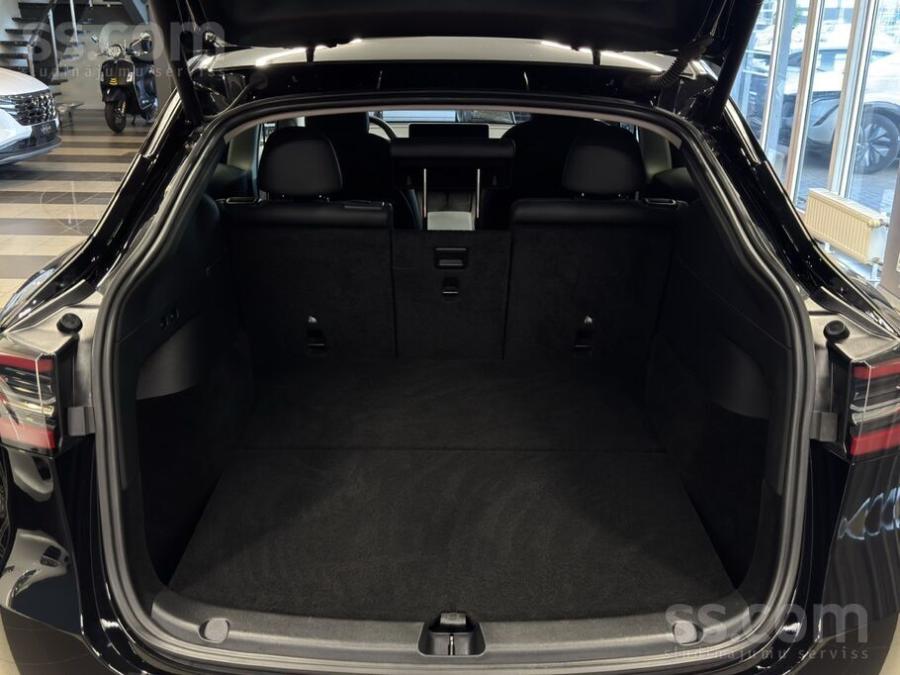 Black Tesla Model Y 2021 in Riga, with an engine capacity of 0.00 L and mileage of 106 thousand km for 32990 €, photo 27 on AUTOMOTO.COM.LV
