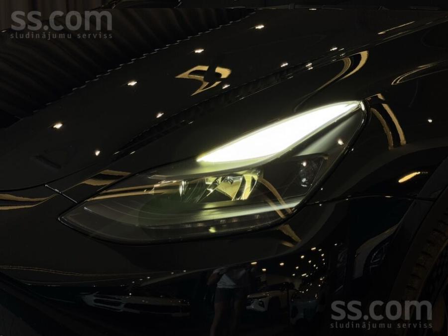 Black Tesla Model Y 2021 in Riga, with an engine capacity of 0.00 L and mileage of 106 thousand km for 32990 €, photo 28 on AUTOMOTO.COM.LV
