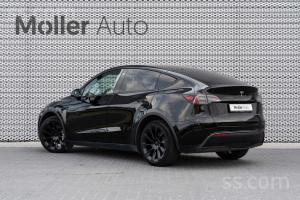 Black Tesla Model Y 2022 in Riga, with an engine capacity of 0.00 L and mileage of 90 thousand km for 35950 €, photo 3 on AUTOMOTO.COM.LV