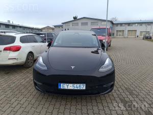 Black Tesla Model Y 2022 in Riga, with an engine capacity of 0.00 L and mileage of 74 thousand km for 31700 €, photo 3 on AUTOMOTO.COM.LV