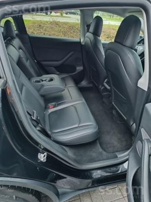 Black Tesla Model Y 2022 in Riga, with an engine capacity of 0.00 L and mileage of 74 thousand km for 31700 €, photo 6 on AUTOMOTO.COM.LV