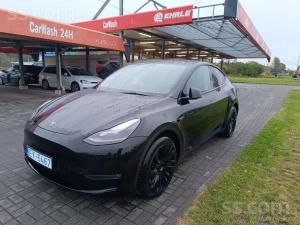 Black Tesla Model Y 2022 in Riga, with an engine capacity of 0.00 L and mileage of 74 thousand km for 31700 €, photo 11 on AUTOMOTO.COM.LV