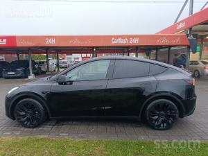 Black Tesla Model Y 2022 in Riga, with an engine capacity of 0.00 L and mileage of 74 thousand km for 31700 €, photo 12 on AUTOMOTO.COM.LV