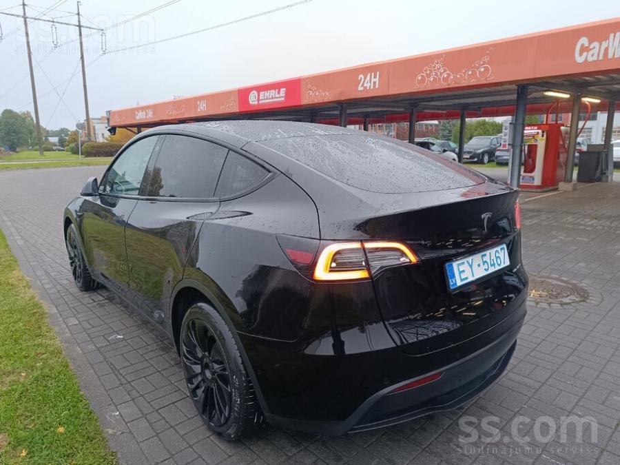 Black Tesla Model Y 2022 in Riga, with an engine capacity of 0.00 L and mileage of 74 thousand km for 31700 €, photo 13 on AUTOMOTO.COM.LV