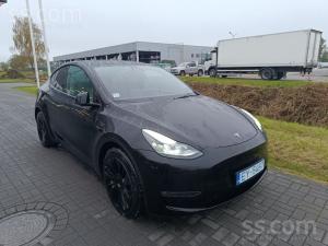 Black Tesla Model Y 2022 in Riga, with an engine capacity of 0.00 L and mileage of 74 thousand km for 31700 €, photo 15 on AUTOMOTO.COM.LV