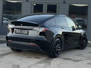 Black Tesla Model Y 2022 in Jelgava, with an engine capacity of 0.00 L and mileage of 80 thousand km for 31900 €, photo 5 on AUTOMOTO.COM.LV