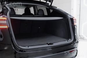 Black Tesla Model Y 2022 in Riga, with an engine capacity of 0.00 L and mileage of 79 thousand km for 34740 €, photo 10 on AUTOMOTO.COM.LV