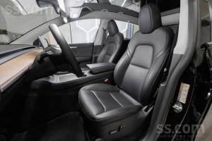 Black Tesla Model Y 2022 in Riga, with an engine capacity of 0.00 L and mileage of 79 thousand km for 34740 €, photo 12 on AUTOMOTO.COM.LV