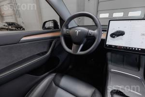 Black Tesla Model Y 2022 in Riga, with an engine capacity of 0.00 L and mileage of 79 thousand km for 34740 €, photo 16 on AUTOMOTO.COM.LV
