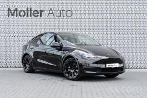 Black Tesla Model Y 2022 in Riga, with an engine capacity of 0.00 L and mileage of 88 thousand km for 39750 €, photo 3 on AUTOMOTO.COM.LV