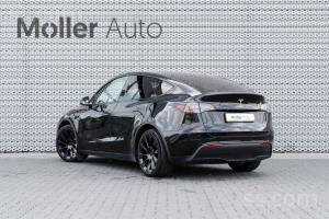 Black Tesla Model Y 2022 in Riga, with an engine capacity of 0.00 L and mileage of 88 thousand km for 39750 €, photo 4 on AUTOMOTO.COM.LV