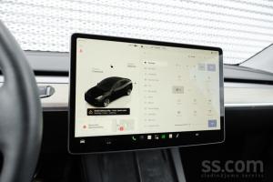 Black Tesla Model Y 2022 in Riga, with an engine capacity of 0.00 L and mileage of 88 thousand km for 39750 €, photo 14 on AUTOMOTO.COM.LV