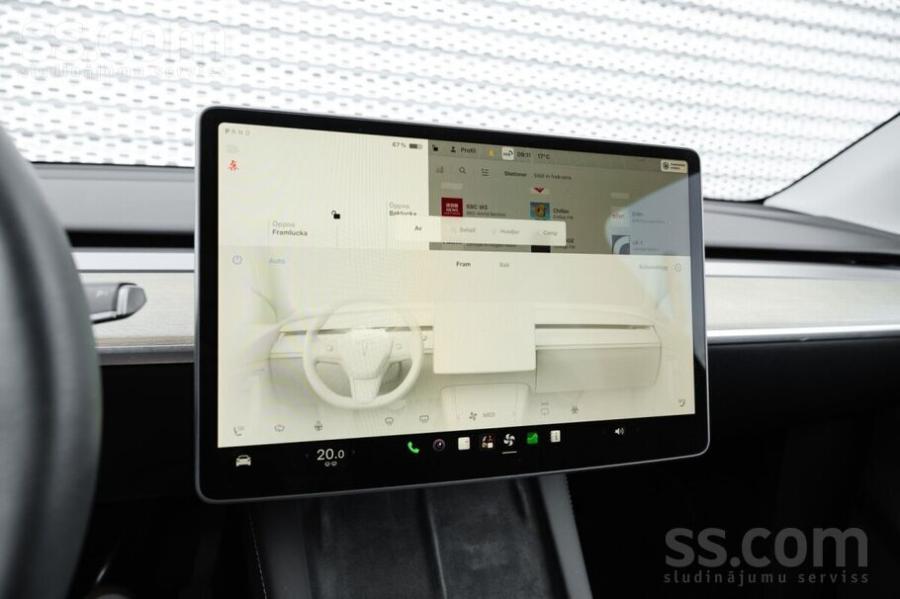 Black Tesla Model Y 2022 in Riga, with an engine capacity of 0.00 L and mileage of 88 thousand km for 39750 €, photo 18 on AUTOMOTO.COM.LV